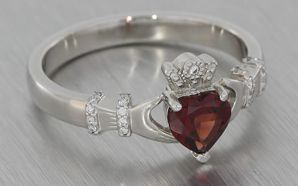 Platinum claddagh ring set with a garnet and diamonds - Durham Rose